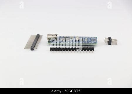 Programmable Micro Controller Board With The Unsoldered Pins Isolated On White Background Stock
