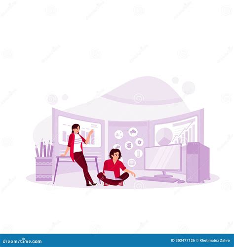 Two Small Programmers Are In Front Of A Large Computer Screen Stock