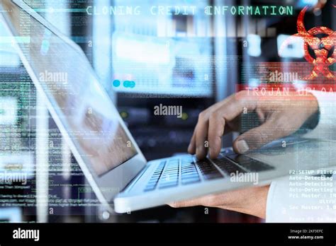 hacker laptop and hands with credit card information typing data with
