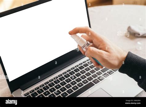 Cleaning Laptop Keyboard With Wet Wipe On Working Place Personal