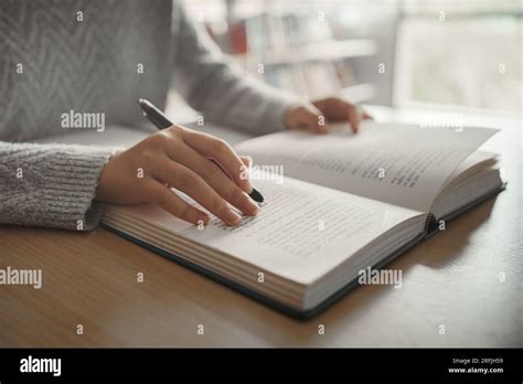 Student Preparing For College Test Exam Reading Book Studying