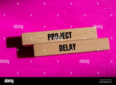 Project Delay Message Written On Wooden Blocks With Pink Background Conceptual Project Delay