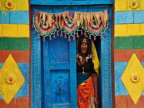 A Young Lambadi Lady Stands At The Entrance Of Her Colourful Home Lambadis Are A Nomadic Lot