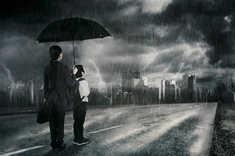 Premium Photo Businesswoman And Her Son Looking At Thunderstorm