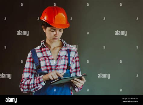 Woman Builder Check Project In Tablet In New Building Concept Of Women S Work In Men S