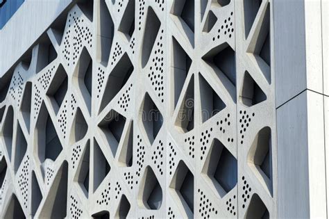 Modern Office Building Facade With Repeating Geometric Patterns Stock