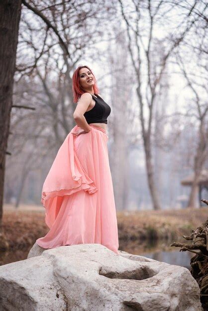 Premium Photo Side View Of Woman Standing By Bare Tree