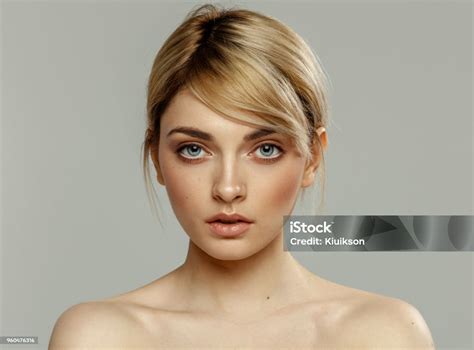 Beauty Portrait Of Blond Woman With Natural Skin Isolated On Grey