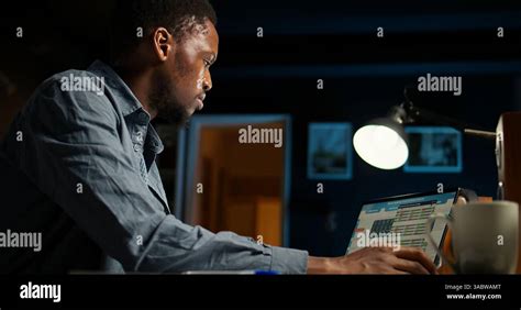 Focused Self Employed Adult Researching Data Driven Topics At Home