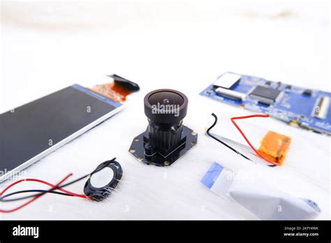 Cctv Camera Lens Parts With A Electronics Component On White Rug Floor