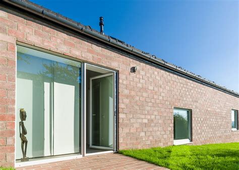 Long Brick House By Foldes Architects Has A 17 Metre Long Bookshelf