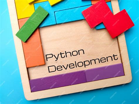 Premium Photo Colored Wooden Puzzle With Text Python Development On A