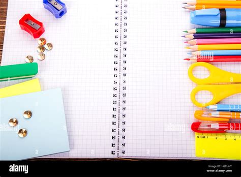 Opened Blank Notebook Frame Of School Supplies Over A Retro Wooden