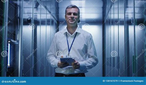Smiling Engineer In Corridor Of Data Center Stock Image Image Of