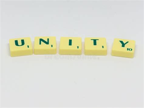 unity in alphabet letters and playing pieces from board games stock