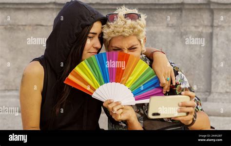 A Non Binary Couple With A Rainbow Fan And A Mobile Gay Prides Day