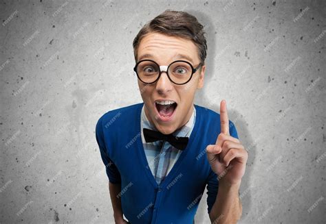 Premium Photo Young Nerd Man Posing On Background