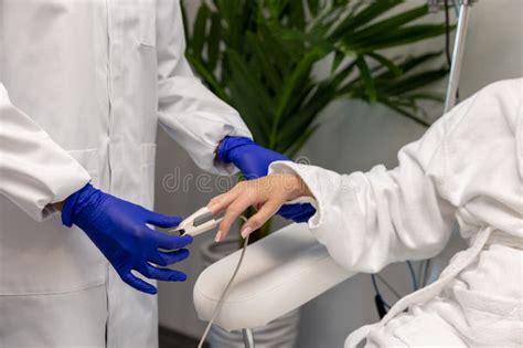 Unknown Nurse Checking Oxygen Level Through Oximeter To Female Patient Stock Photo Image Of