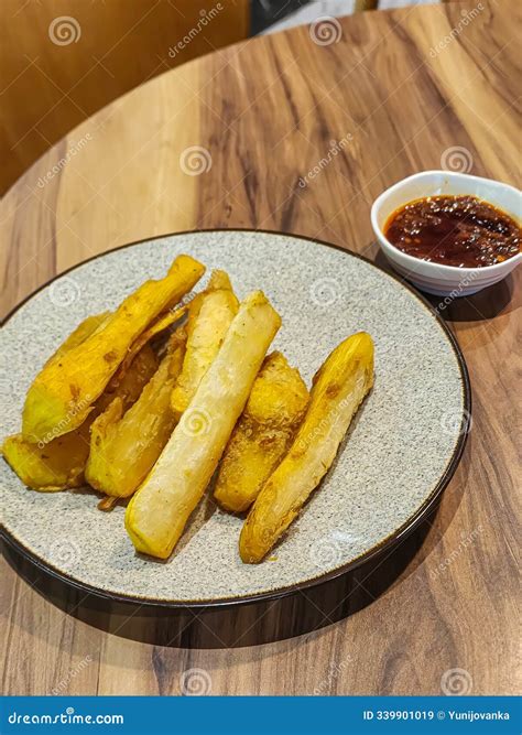 Fried Cassava In Wood Background Royalty Free Stock Image