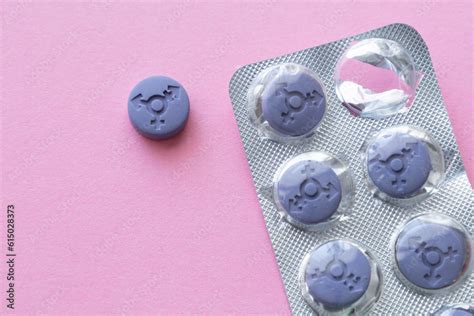 Purple Pill With A Transgender Gender Symbol In A Blister Hormonal