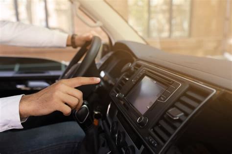 Premium Photo Man Using Navigation System While Driving Car Closeup