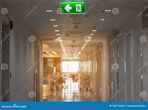 The Green Emergency Exit Sign In Hospital Showing The Way To Escape Stock Photo Image Of