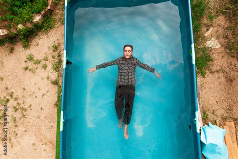 Relaxed Dressed Man Floating In Plastic Pool Stock Photo Adobe Stock