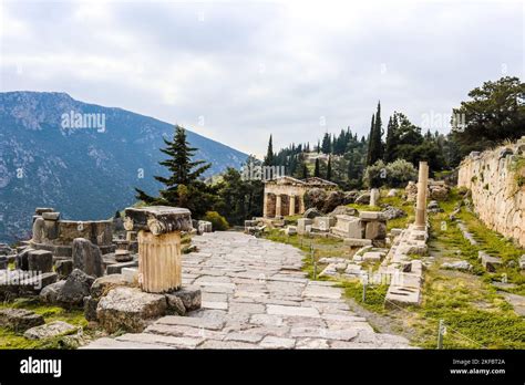 Rock Walkway Down Hill In Ancient Delphi Greece Past Ionic Columns And