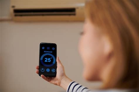 Premium Photo Woman Controlling Air Conditioner In Bathroom