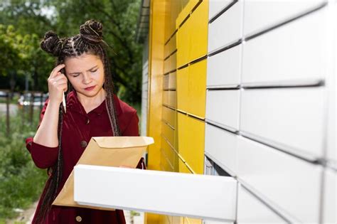 Premium Photo A Teenage Girl Wonders How To Describe The Envelope She Wants To Send To Her