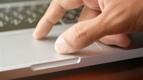 4k Close Up A Man Working With Notebook Laptop Using Finger With Keyboard And Touchpad Or