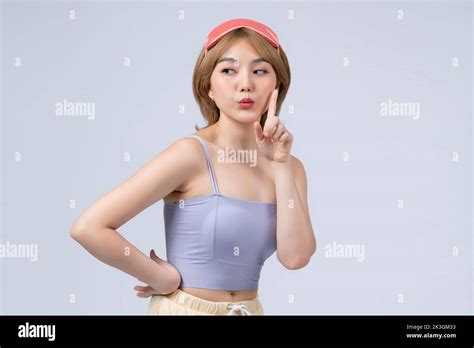 Woman In Eye Sleeping Mask Shows Gesture And Behave Silently On White