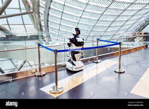 Robot In Full Growth In Museum Energy Of Future Glass Dome With Solar Panels Autonomous