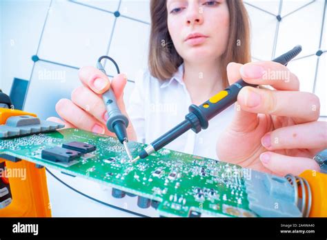 Girl With Measuring Devices In The Electronics Laboratory Stock Photo Alamy