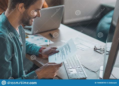 joyful smart it man looking at the code stock image image of java
