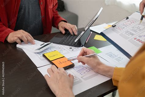 team of ui ux web designer are working together to develop mobile