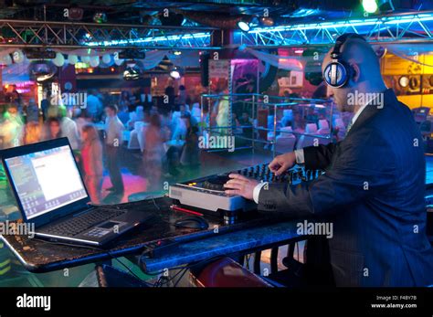 DJ Behind The Control Panel Stock Photo Alamy