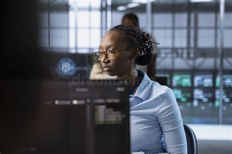 Data Center Employee Conducting Security Audits To Protect Against