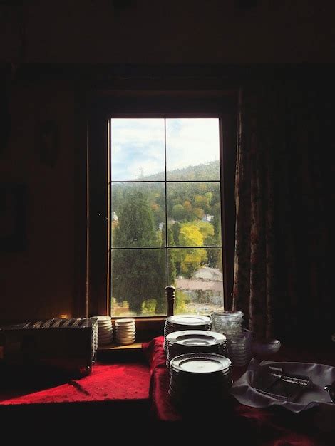 Premium Photo View Of Glass Window On Table At Home