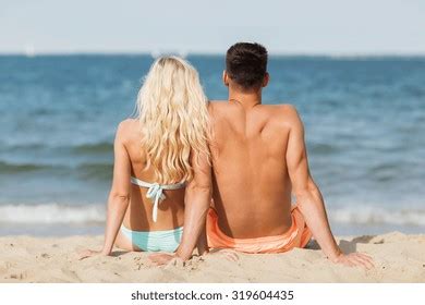 Стоковая фотография 509080054 Couple Naturist Women Sitting On Beach