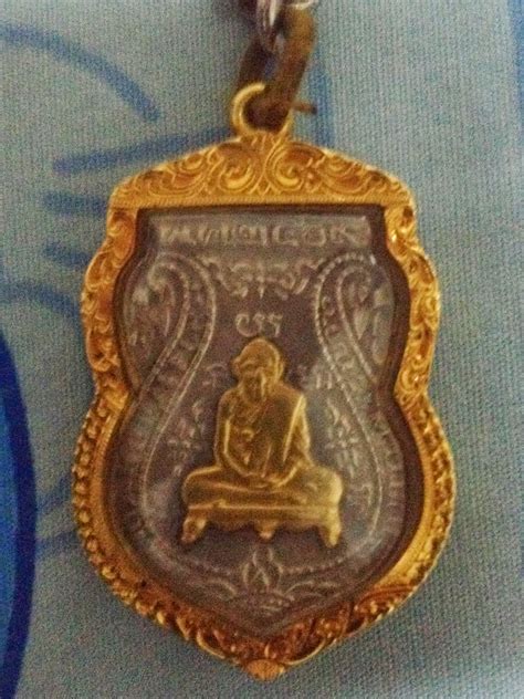 เหรียญเงินหน้าทอง รุ่นแรก หลวงพ่อกลั่น พิมพ์ขอเบ็ด เหรียญหลวงพ่อกลั่น วัดพระญาติ พ ศ 2469 รุ่น