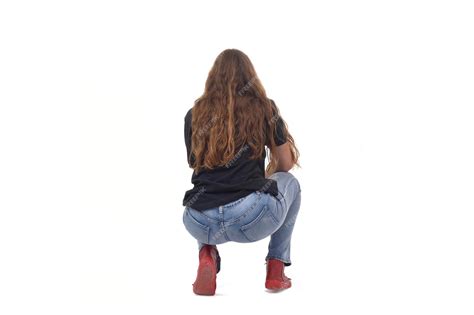Premium Photo Back View Of A Young Girl Longhaired Sitting Squatting