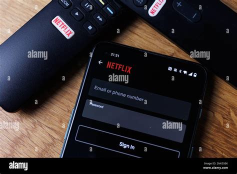Netflix Login On Smartphone Display New Password Sharing Rules On Netflix Stock Photo Alamy