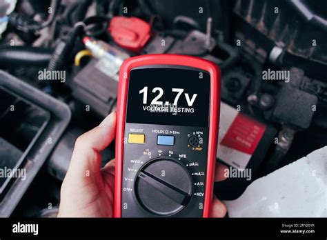 Car Battery Voltage Testing With A Digital Multimeter By Auto