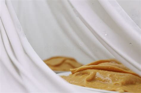 Crab Ravioli In Saffron Sauce Soft Side Light Through Sheer Curtain