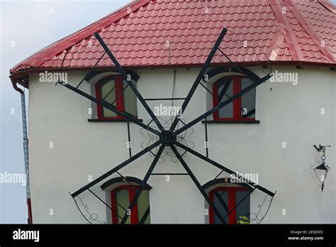Decorative Windmill Tips On Retro House Facade In Rural Countryside