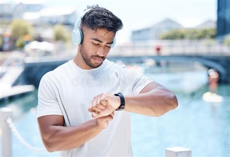 Fitness Music And Man In City With Smart Watch For Running Exercise And Tracking Workout