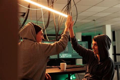 Premium Photo Successful Cyberattack Happy Hackers Giving High Five