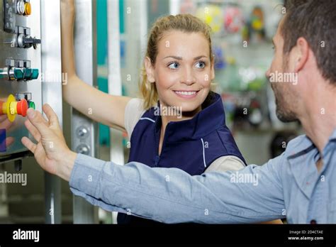 Female Cnc Operator Talking To Colleague Stock Photo Alamy