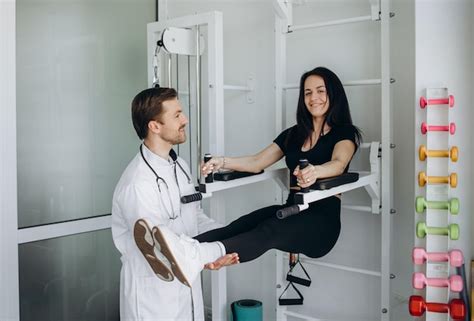 Premium Photo Young Fitness Woman Doing Kinesiotherapy Rehabilitation